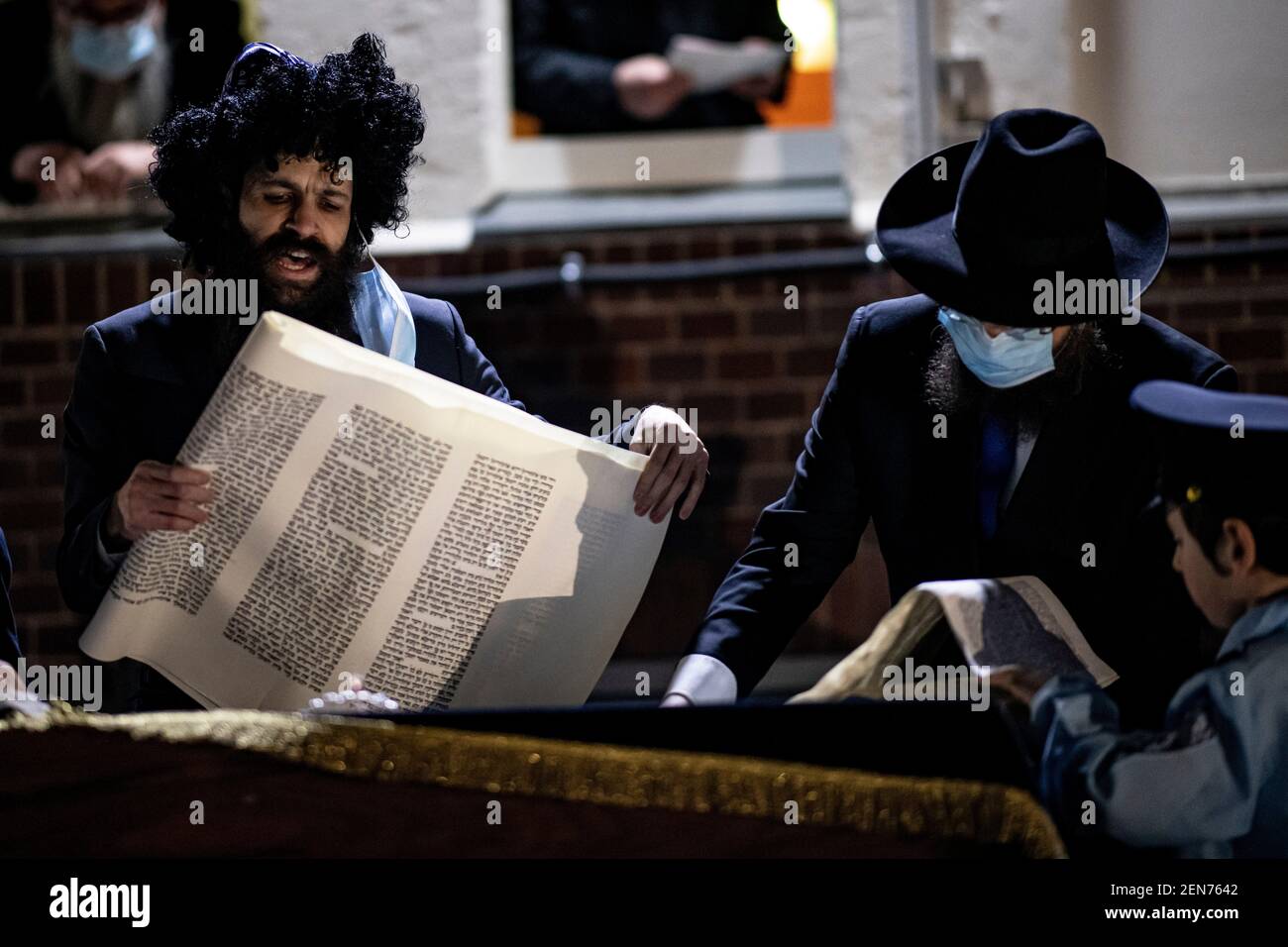 Berlin, Germany. 25th Feb, 2021. Two rabbis read the Torah at the ...