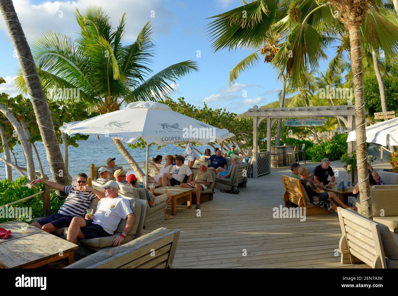Relaxing on the deck at the Cooper Island Beach Club, Cooper Island ...