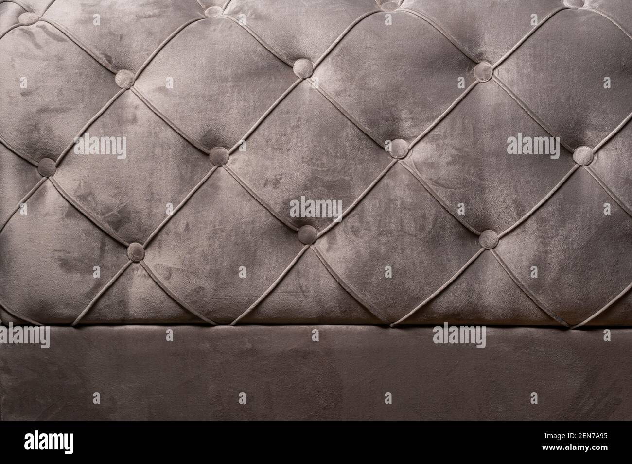 Gray velvet sofa background texture with sunken buttons, close up ...