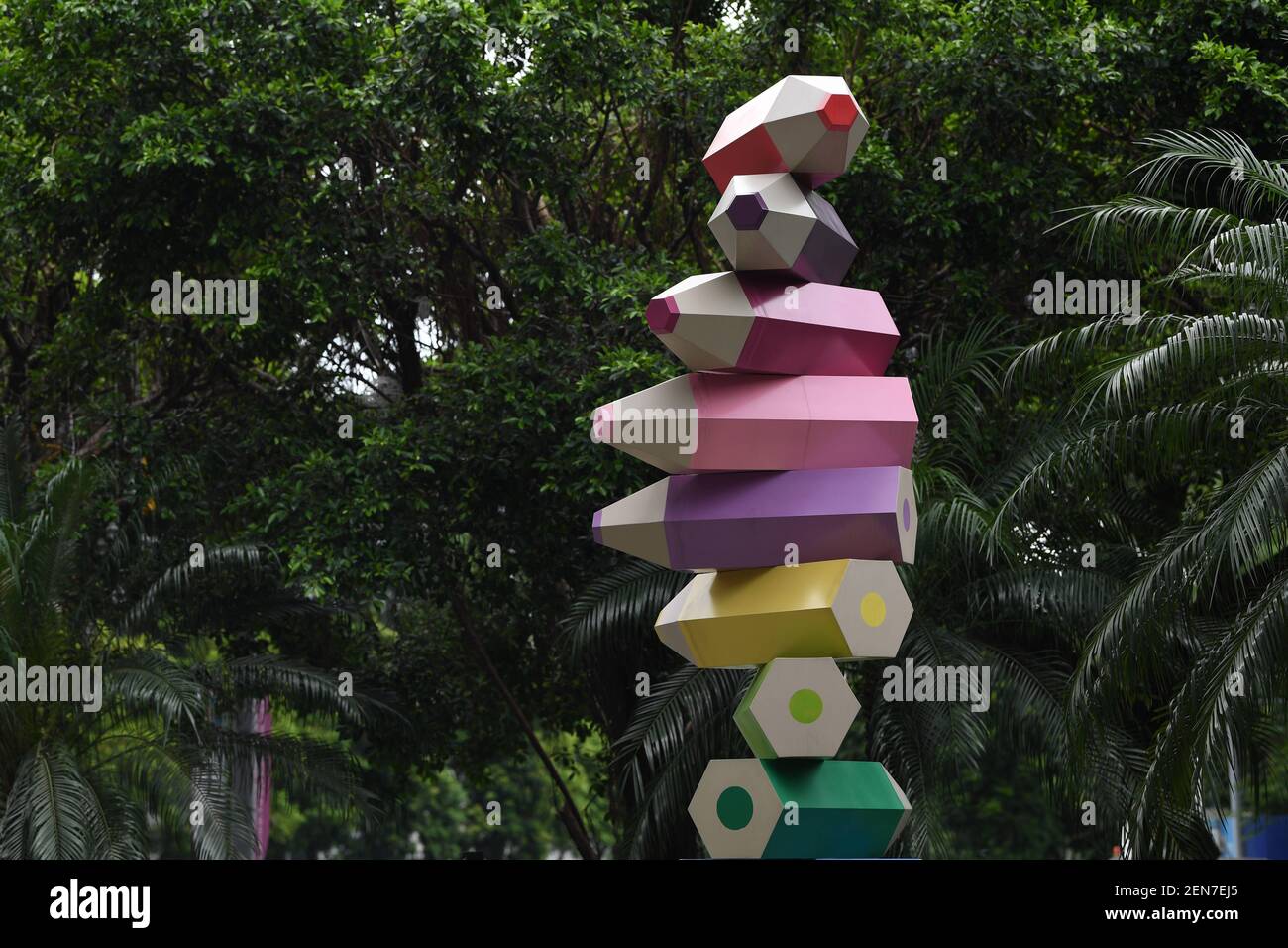 A colored pencil installation is on display at a square amongst office ...