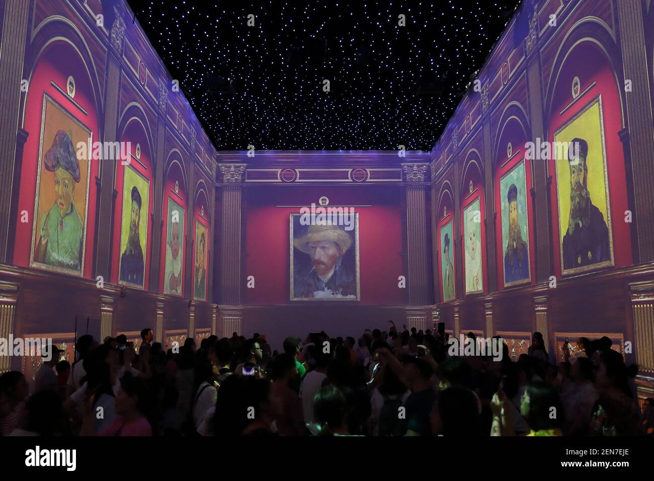 Visitors view or take pictures of a projection of art by Dutch post ...