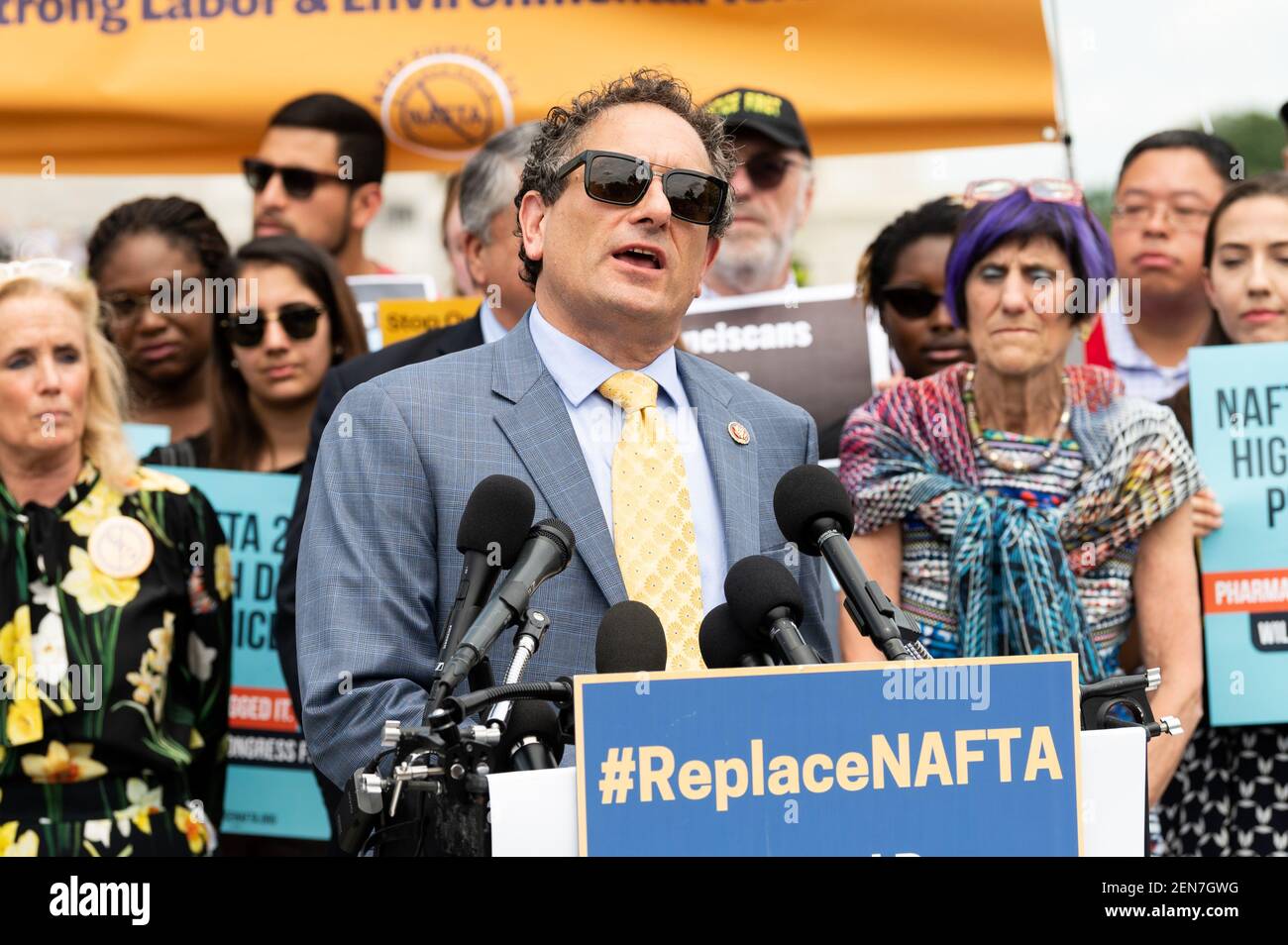 U.S. Representative Andy Levin (D-MI) speaking at a rally against the ...