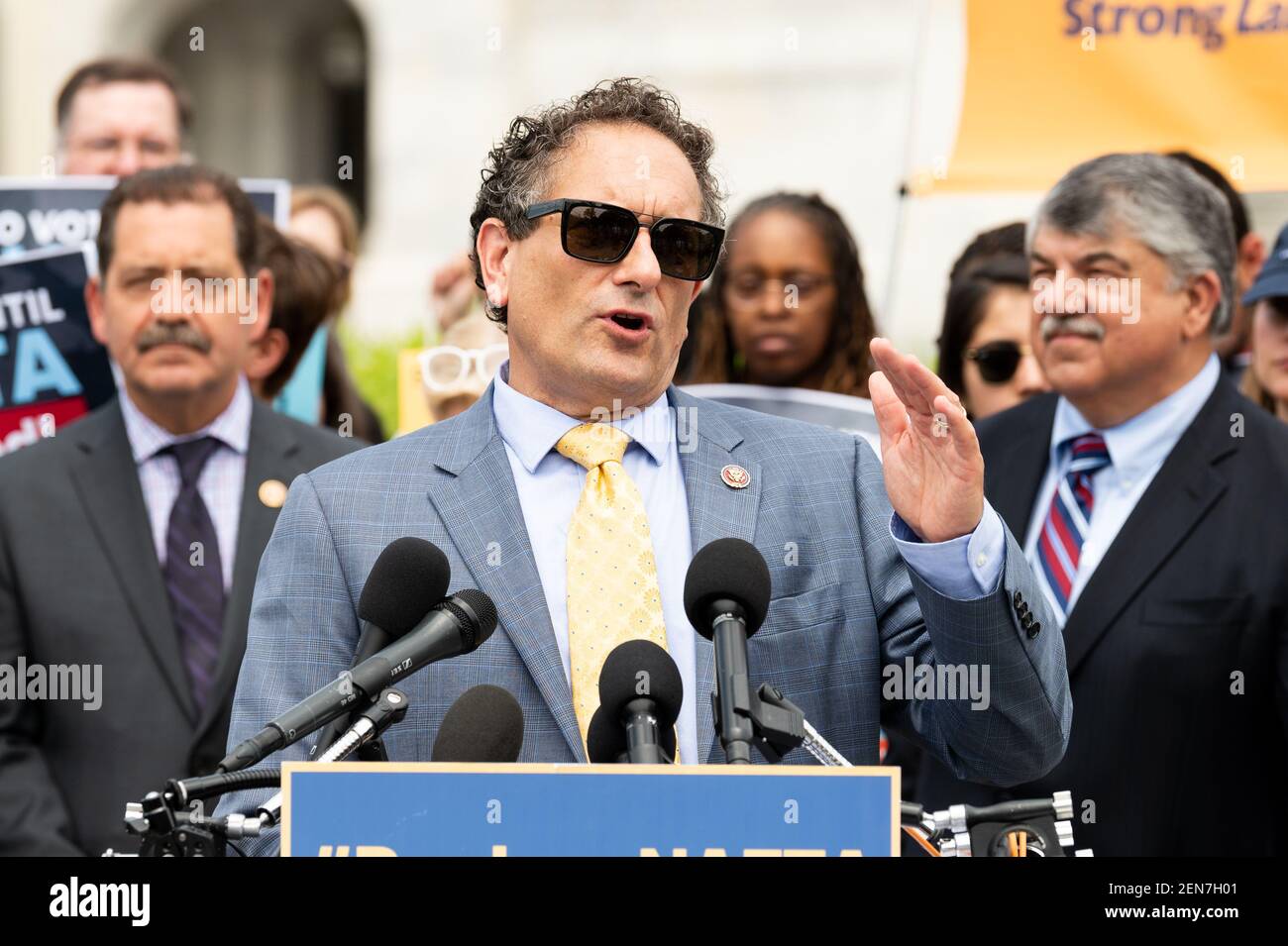U.S. Representative Andy Levin (D-MI) speaking at a rally against the ...