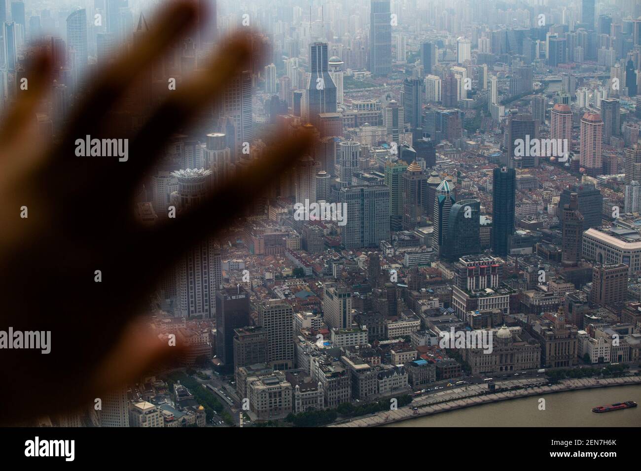 Residential houses in longtang are embraced by skyscrapers and high ...