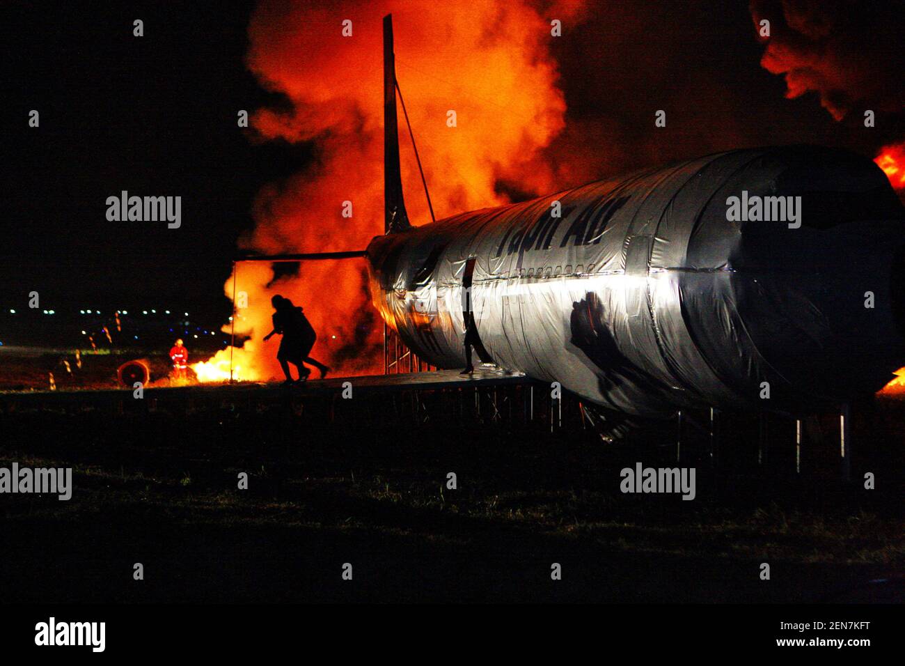 Officers seen evacuating a passenger out of a plane that had caught ...