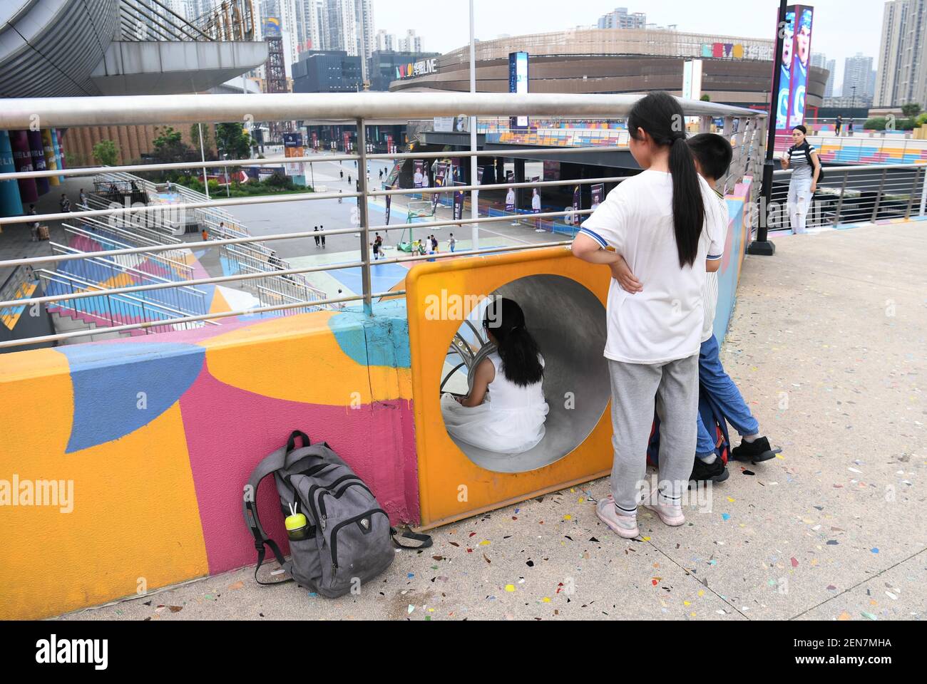 A child tries out a 10-meter-high spiral slide from the first floor of ...