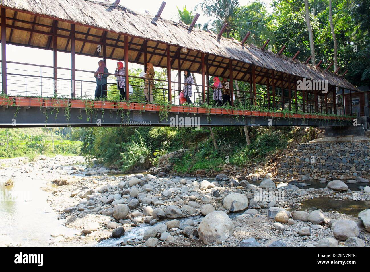 Residents seen crossing the crossing bridge in Sentul Eco Edu tourism Forest, Bogor Regency ...