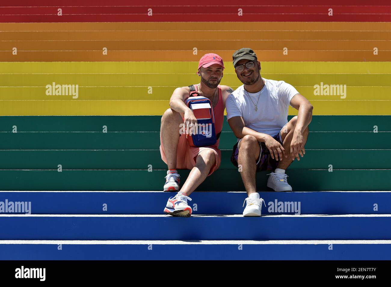 (L-R) Felix Davila and Patrick Monge sit for a photo on the LGBTQ pride ...