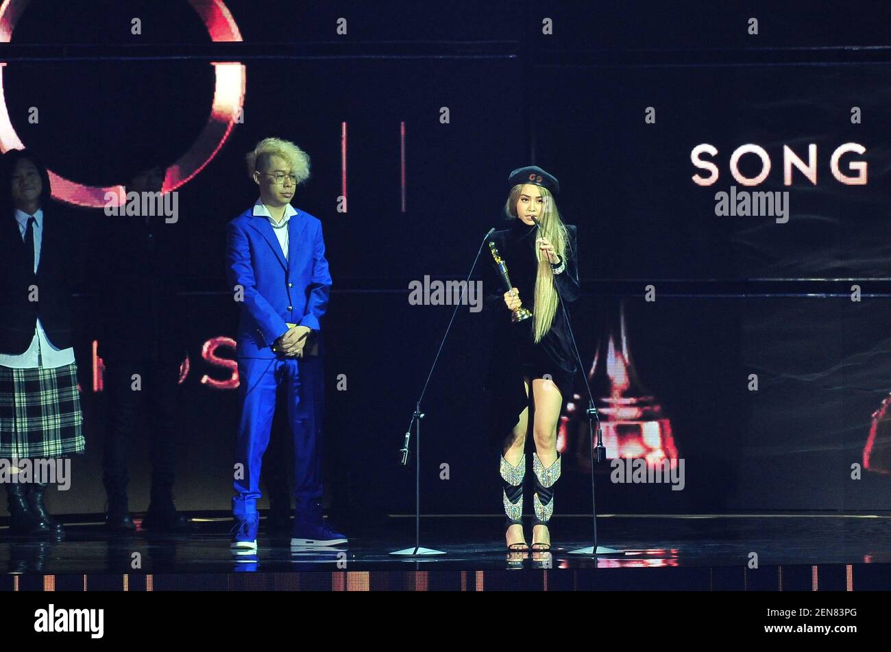 Taiwanese singer Jolin Tsai poses with her trophy after winning "Song ...