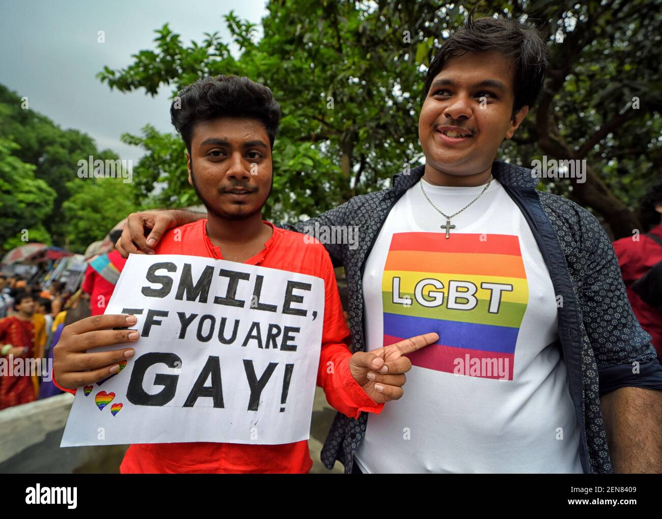 Two proud Gay member of LGBT community showing a poster and poses for ...