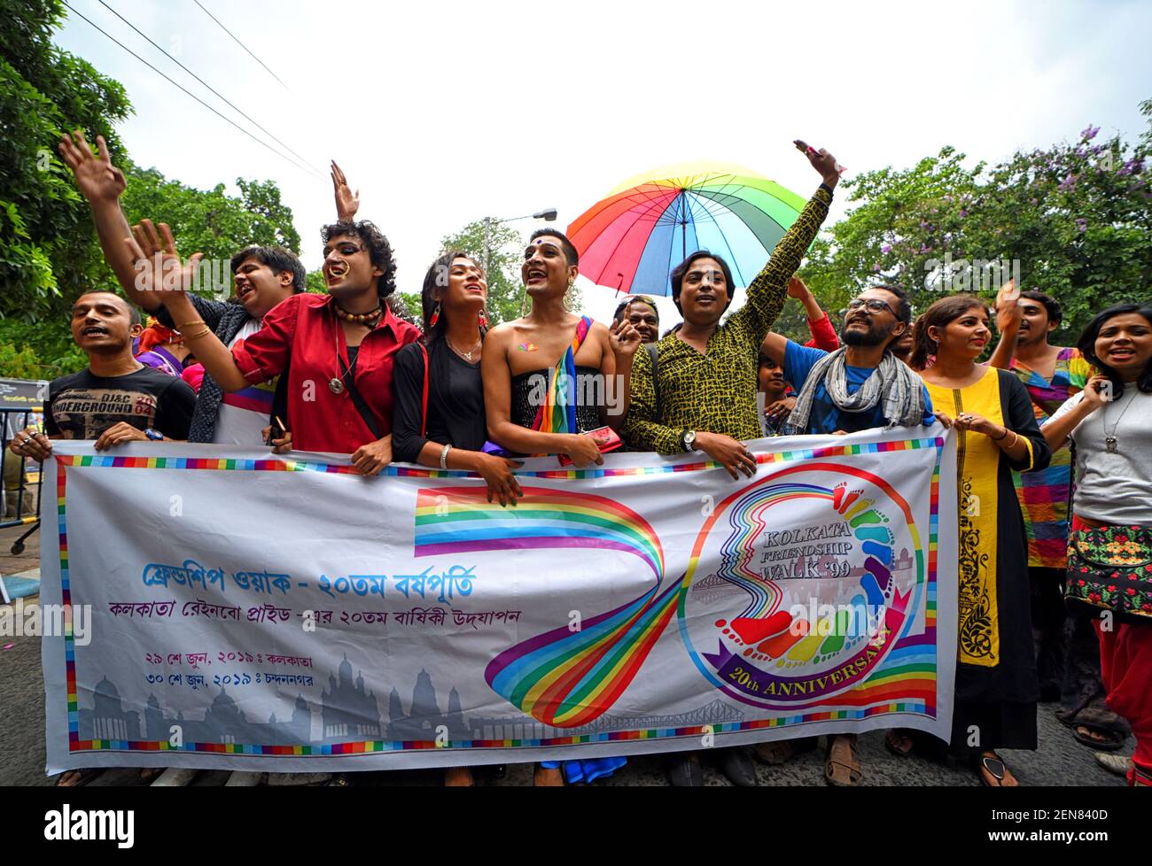LGBT Community members seen walking with a colorful banner during the ...