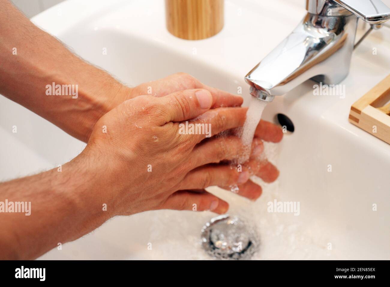 Wash hands close up- male hands using soap and tap water concept hand ...