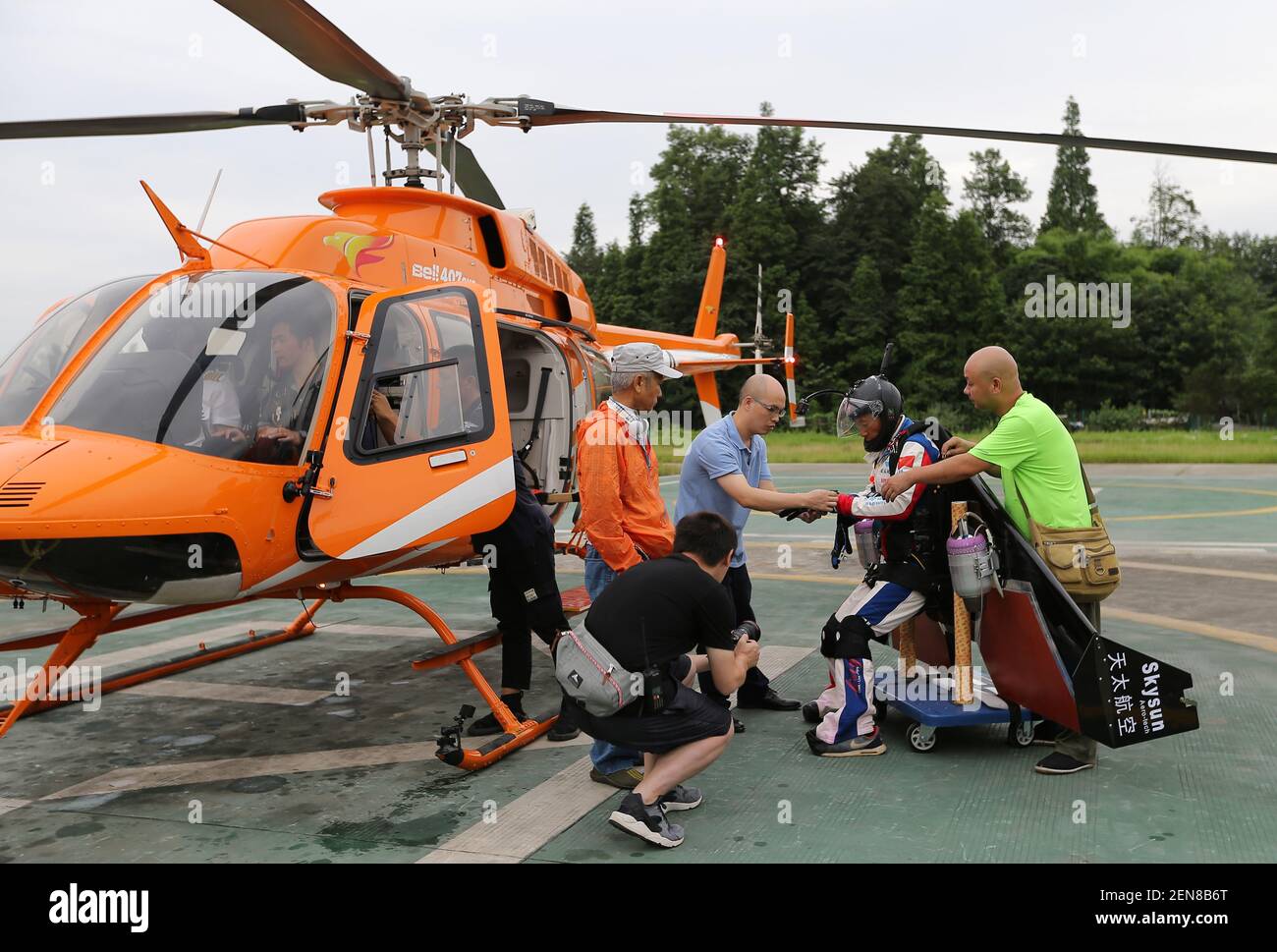 Chinese athlete Sheng Guangqiang wearing a jetwing powered by turbojet ...