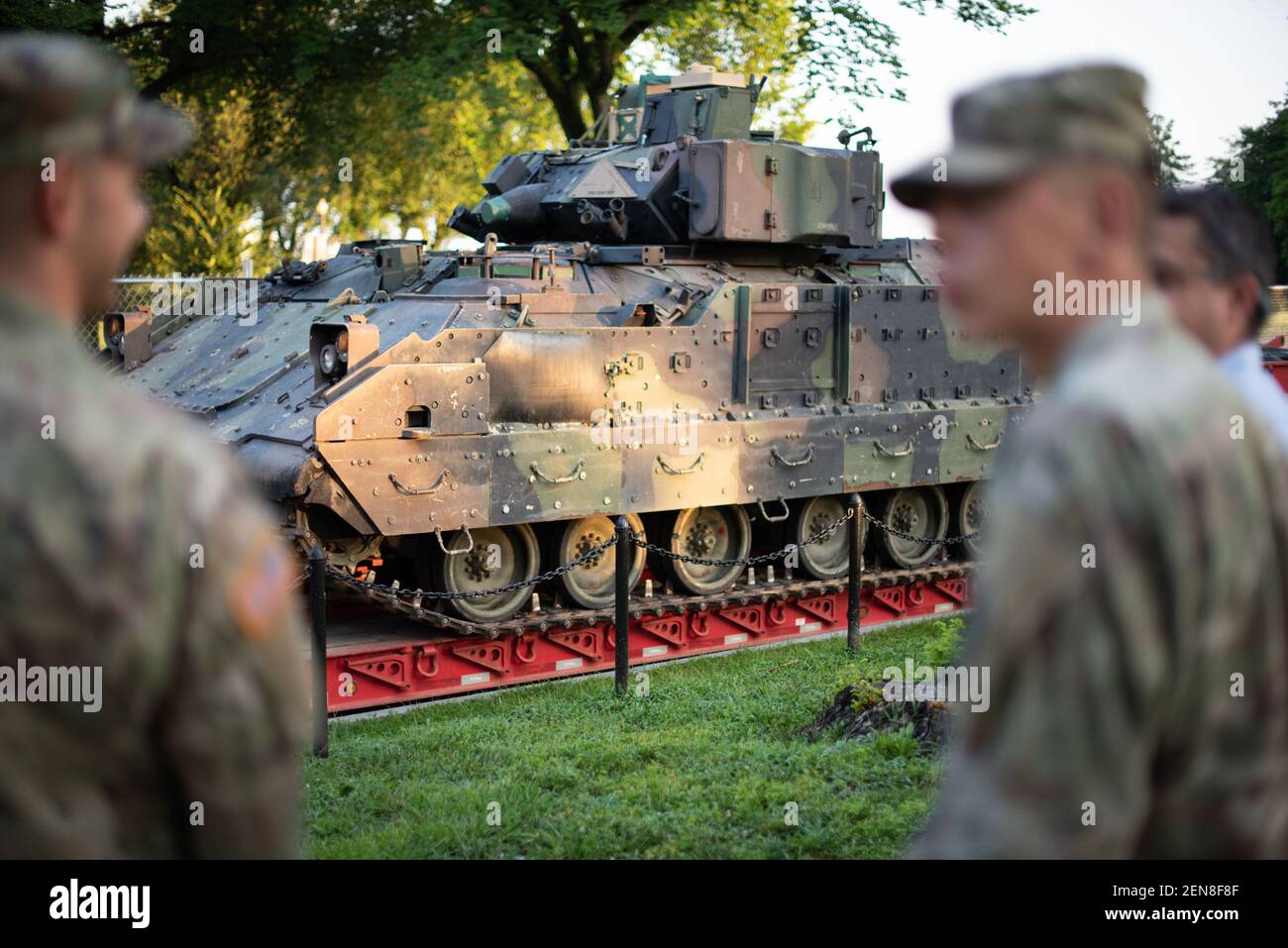 Members of the U.S. Armed Forces stand with two M2 Bradley Infantry ...