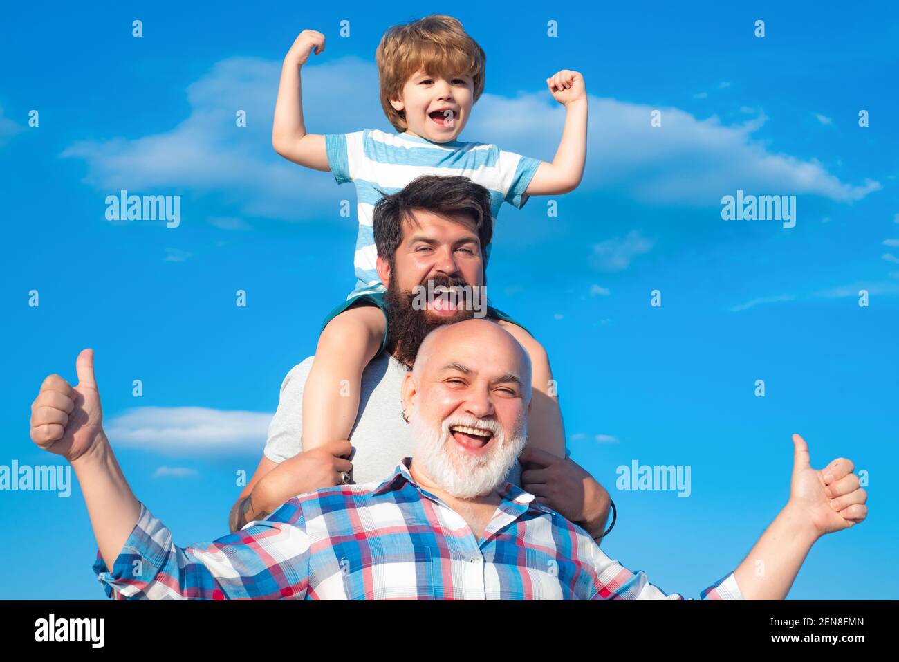 Man family outdoor. Happy three generations of men have fun and smiling ...