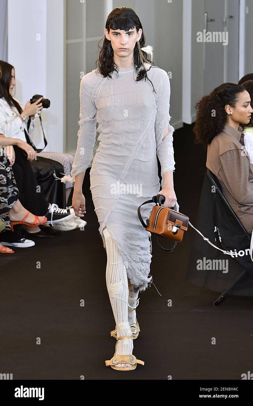 A model walks on the runway during the Acne Studios Womenswear Spring ...