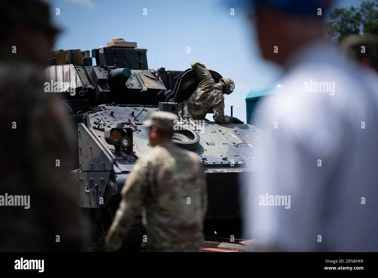 The drive of an M2 Bradley Infantry Fighting Vehicle climbs into the ...