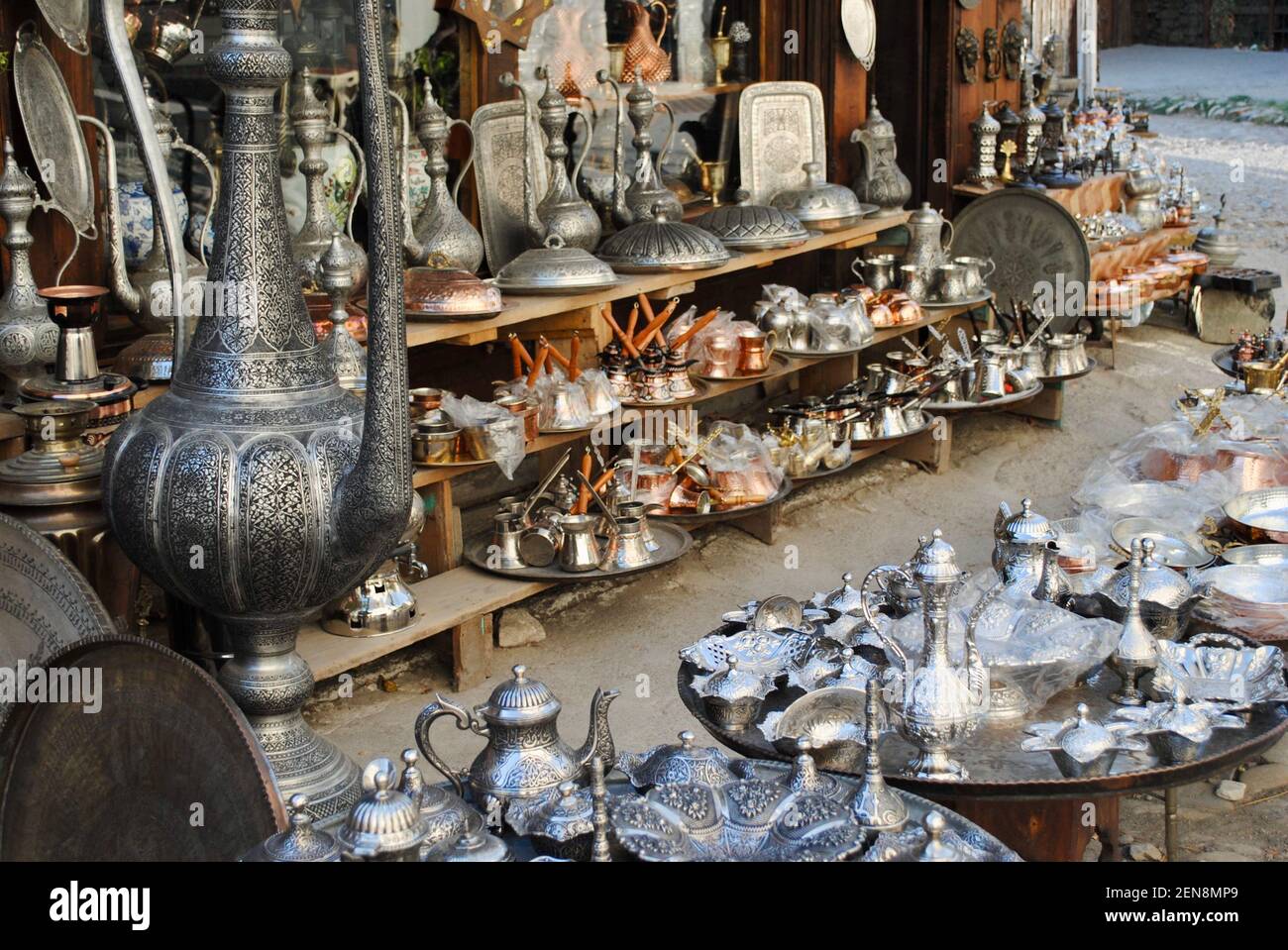 A display of traditional Turkish souvenirs of bronze and copper ...