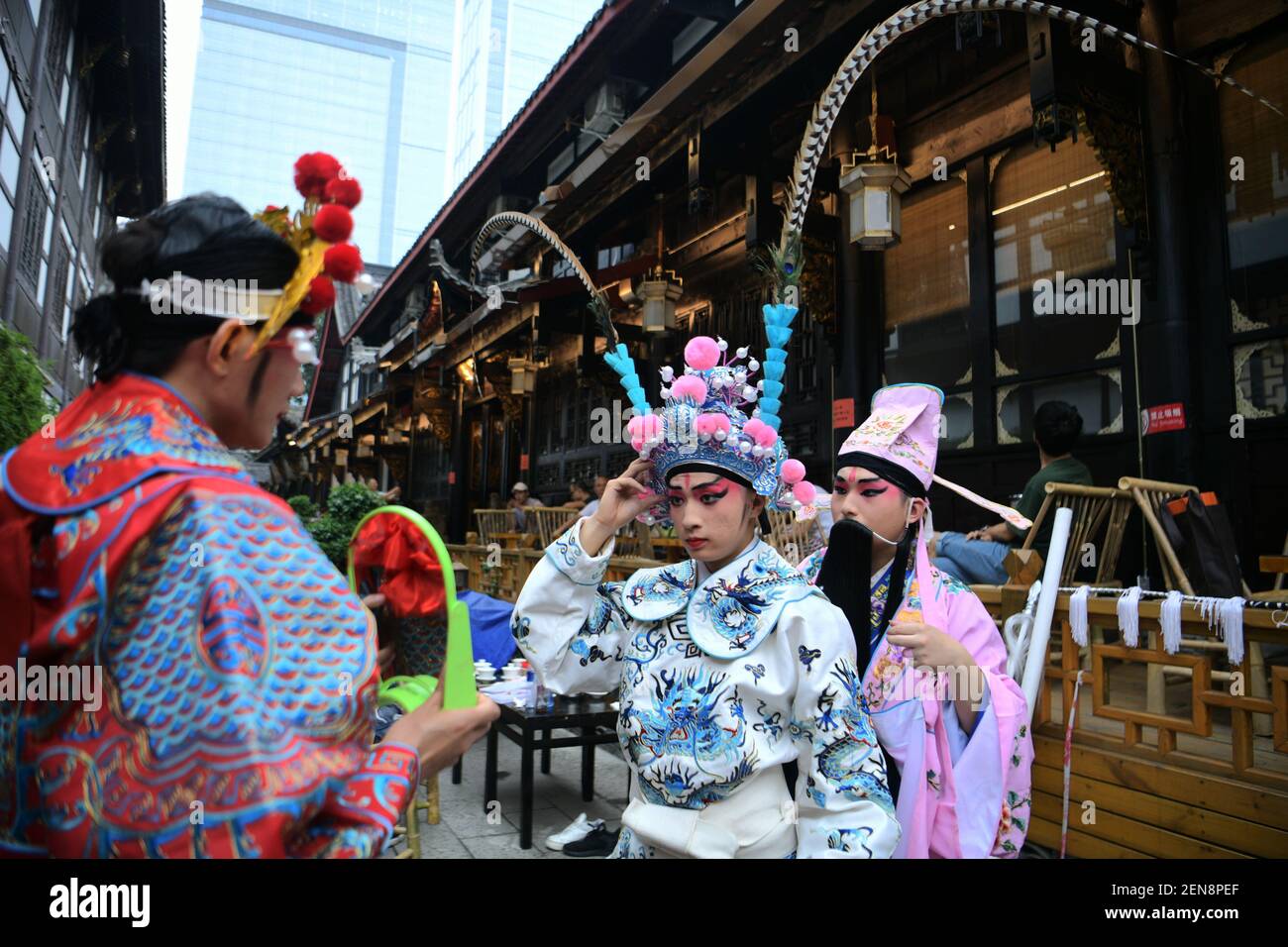The Sichuan opera performers are performing on street in Chengdu ...
