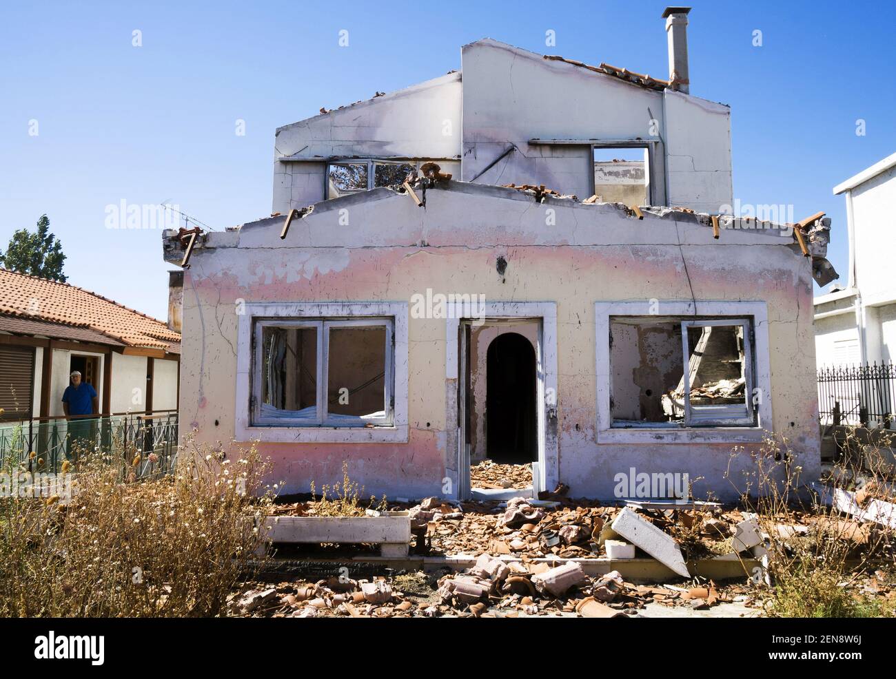 Destroyed houses near Attica, Greece on July 2, 2019. Nearly a year ...