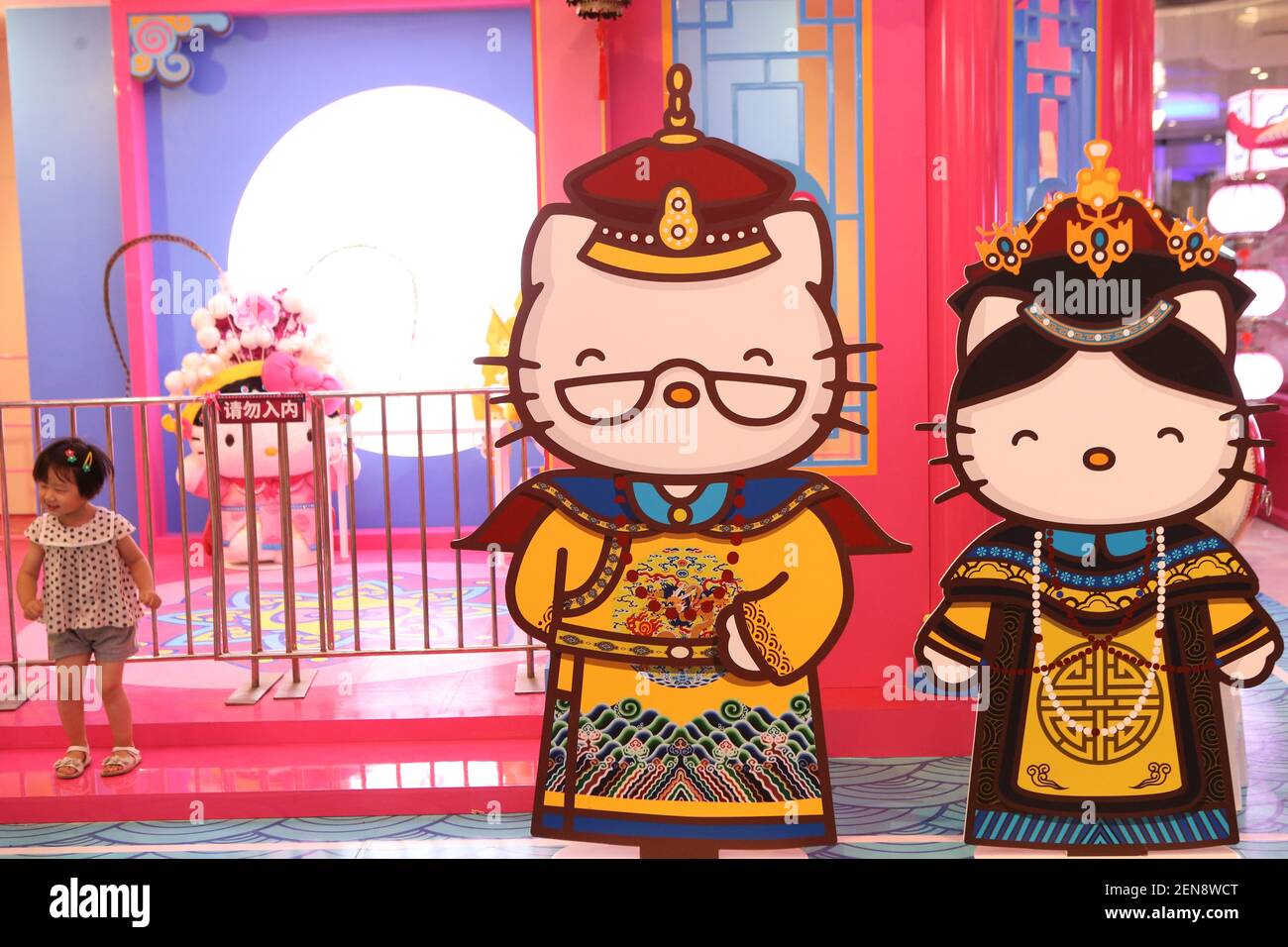 Cartoon characters from Hello Kitty dressed in traditional costumes of ...