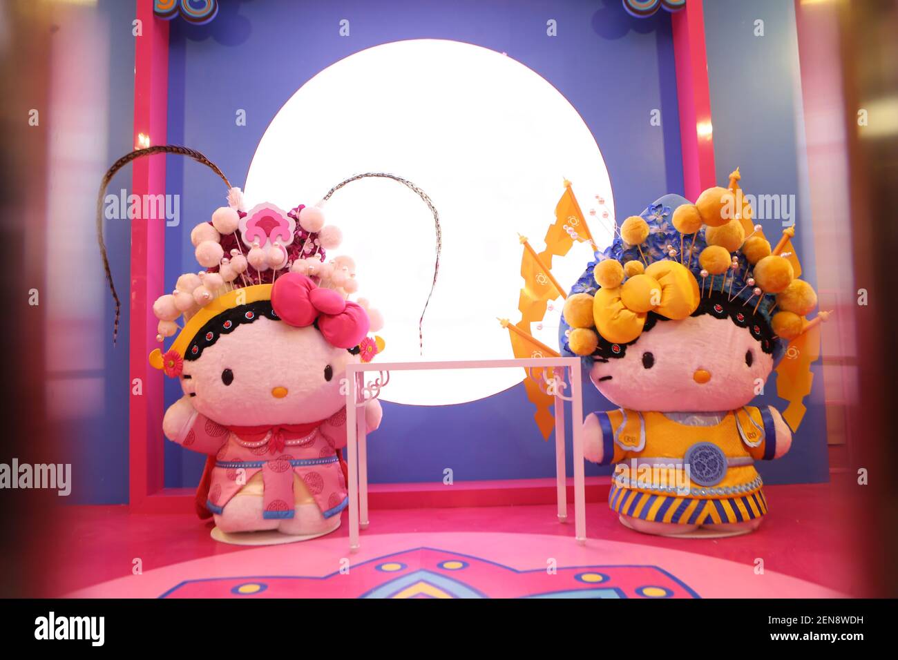 Cartoon characters from Hello Kitty dressed in traditional costumes of ...