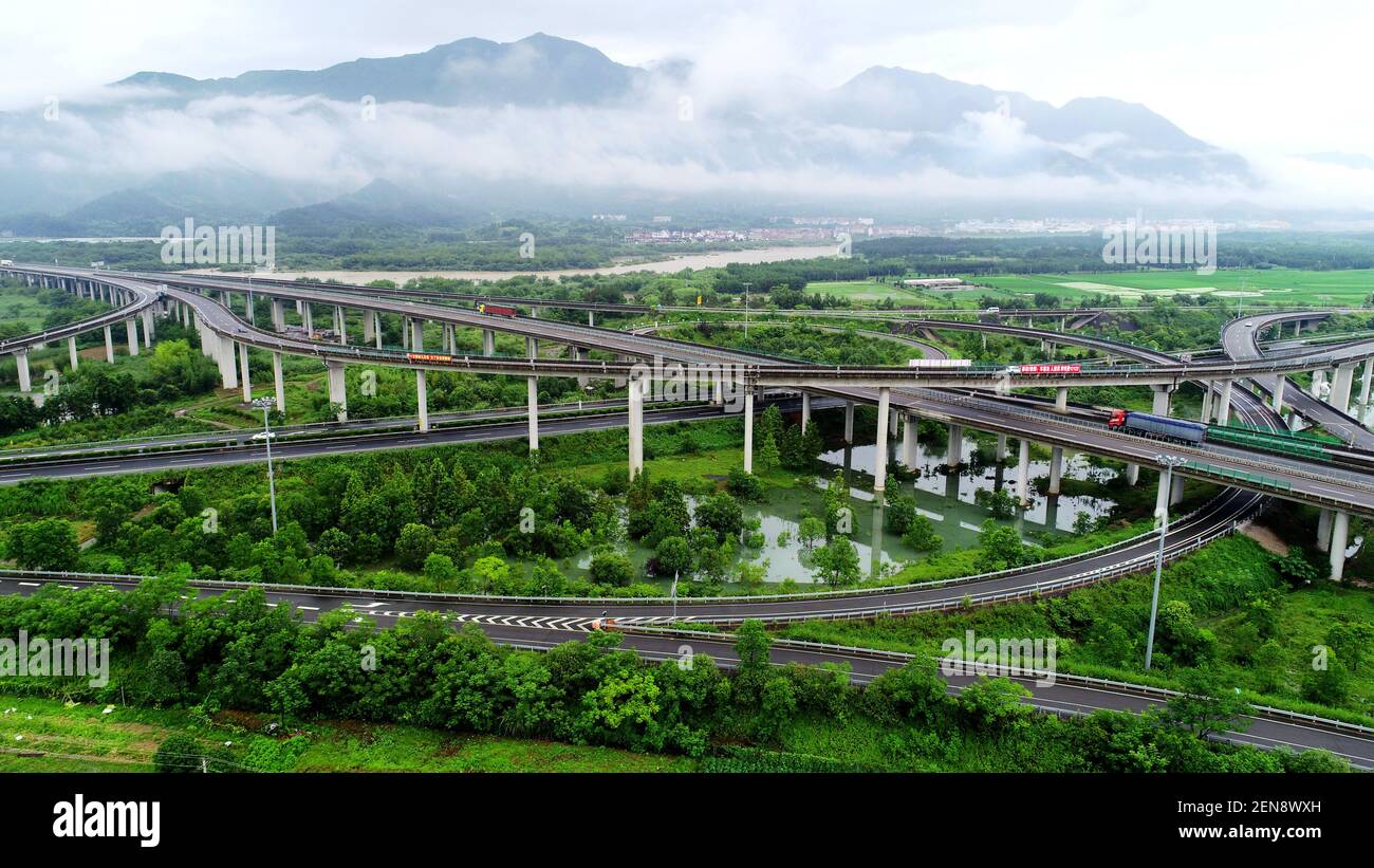Aerial view of the Zhuyong Expressway enveloped by mist and cloud in ...