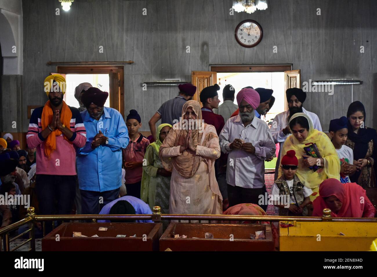 Devotees pray at a Sikh temple during a birth anniversary of the sixth ...