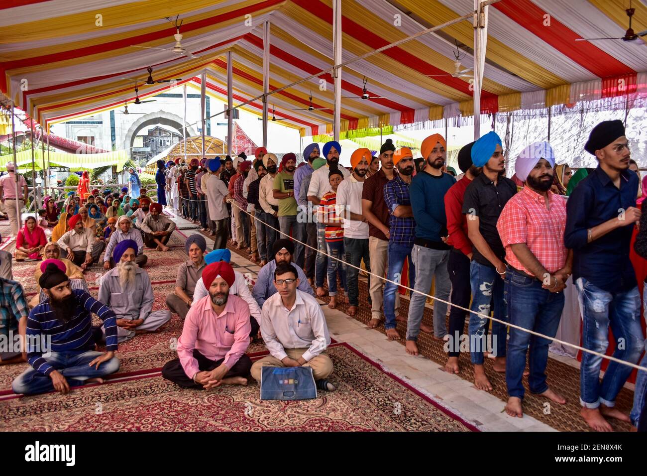 Devotees pay obeisance at a Sikh temple during a birth anniversary of ...