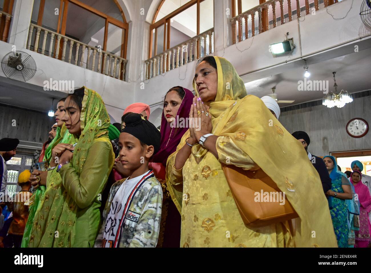Devotees pray at a Sikh temple during a birth anniversary of the sixth ...