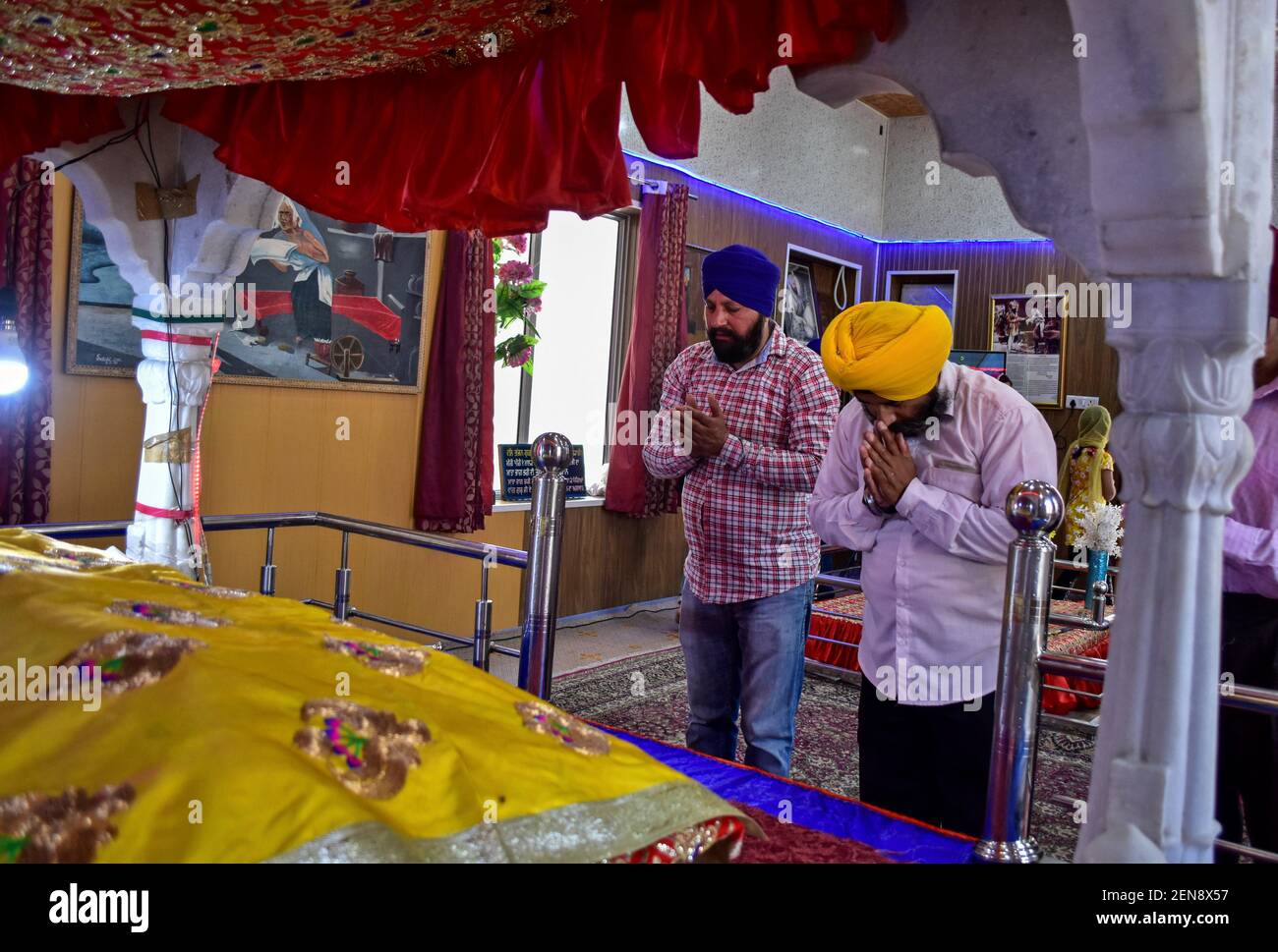 Devotees pray at a Sikh temple during a birth anniversary of the sixth ...