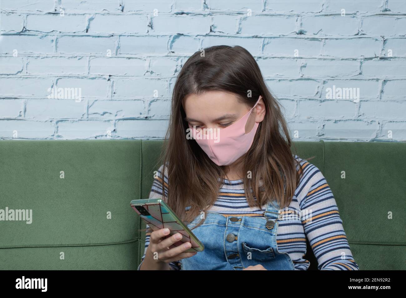 Using face mask to prevent covid and taking selfie Stock Photo - Alamy
