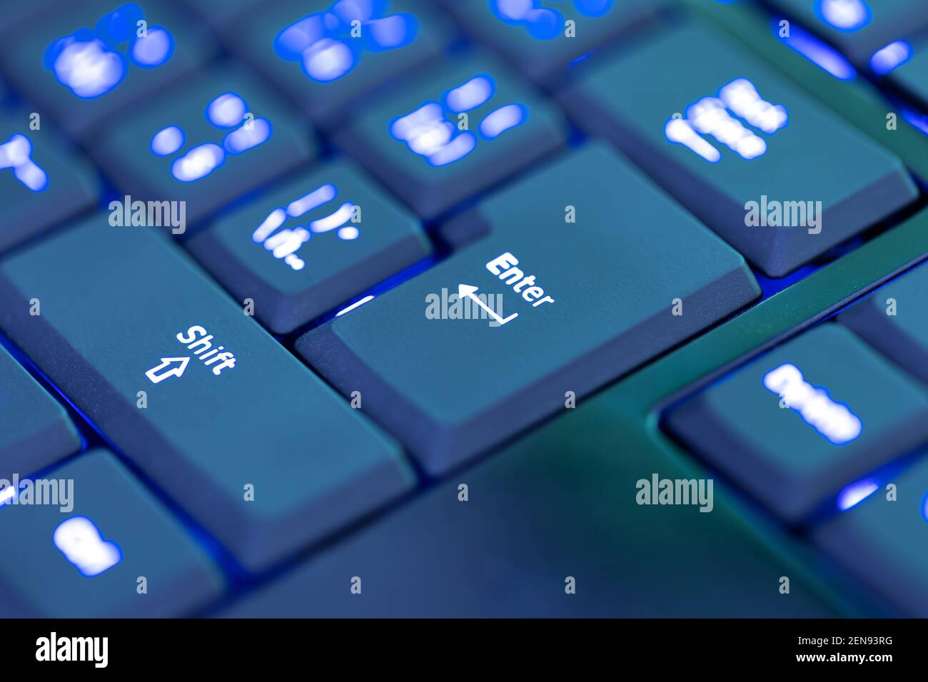 Closeup of laptop or desktop computer keyboard illumination, blue ...