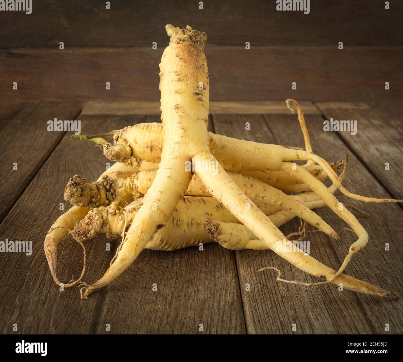 Ginseng root is placed on the wooden floor; Herbal Health Care Stock ...