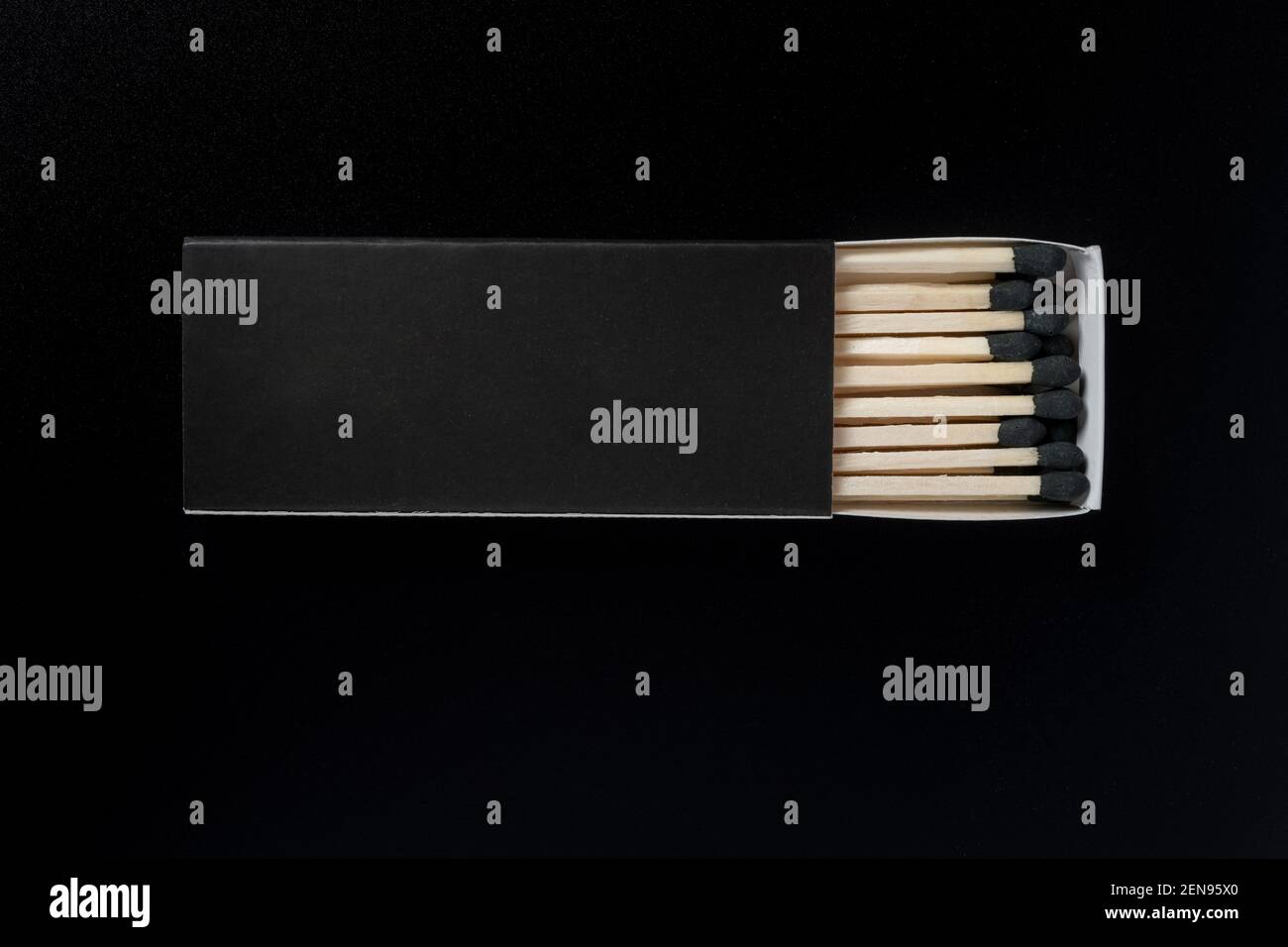 black matchbox and black match sticks on a black background Stock Photo ...