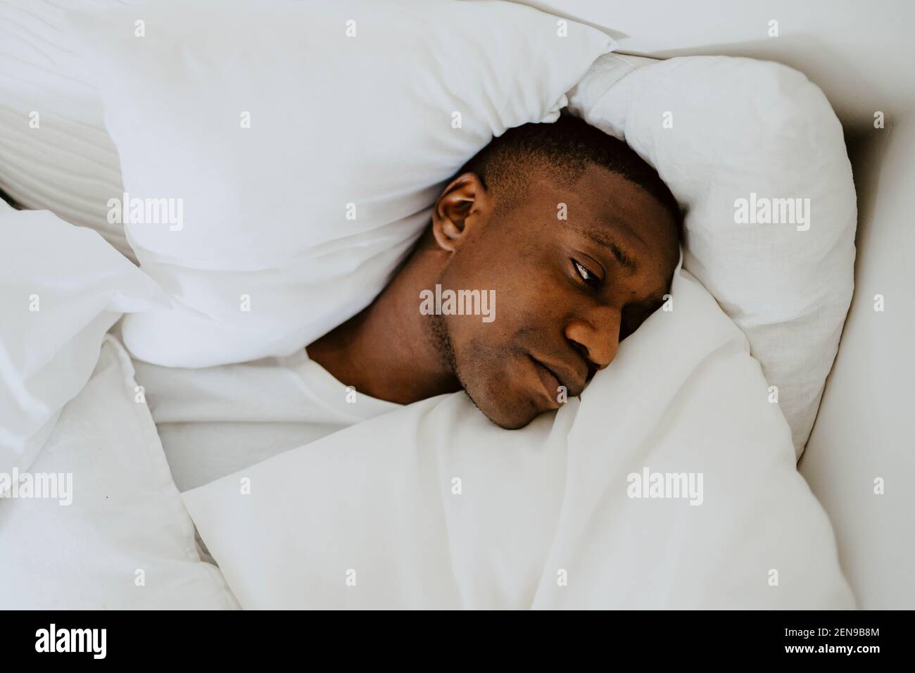 African man resting indoors hi-res stock photography and images - Alamy