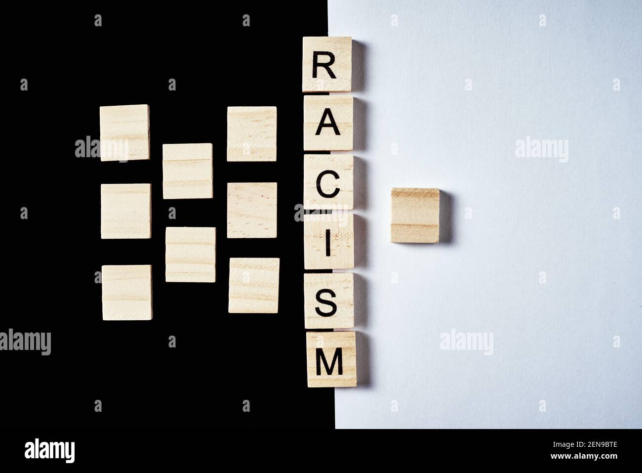 Many wooden blocks separated from one with word racism. Concept of ...