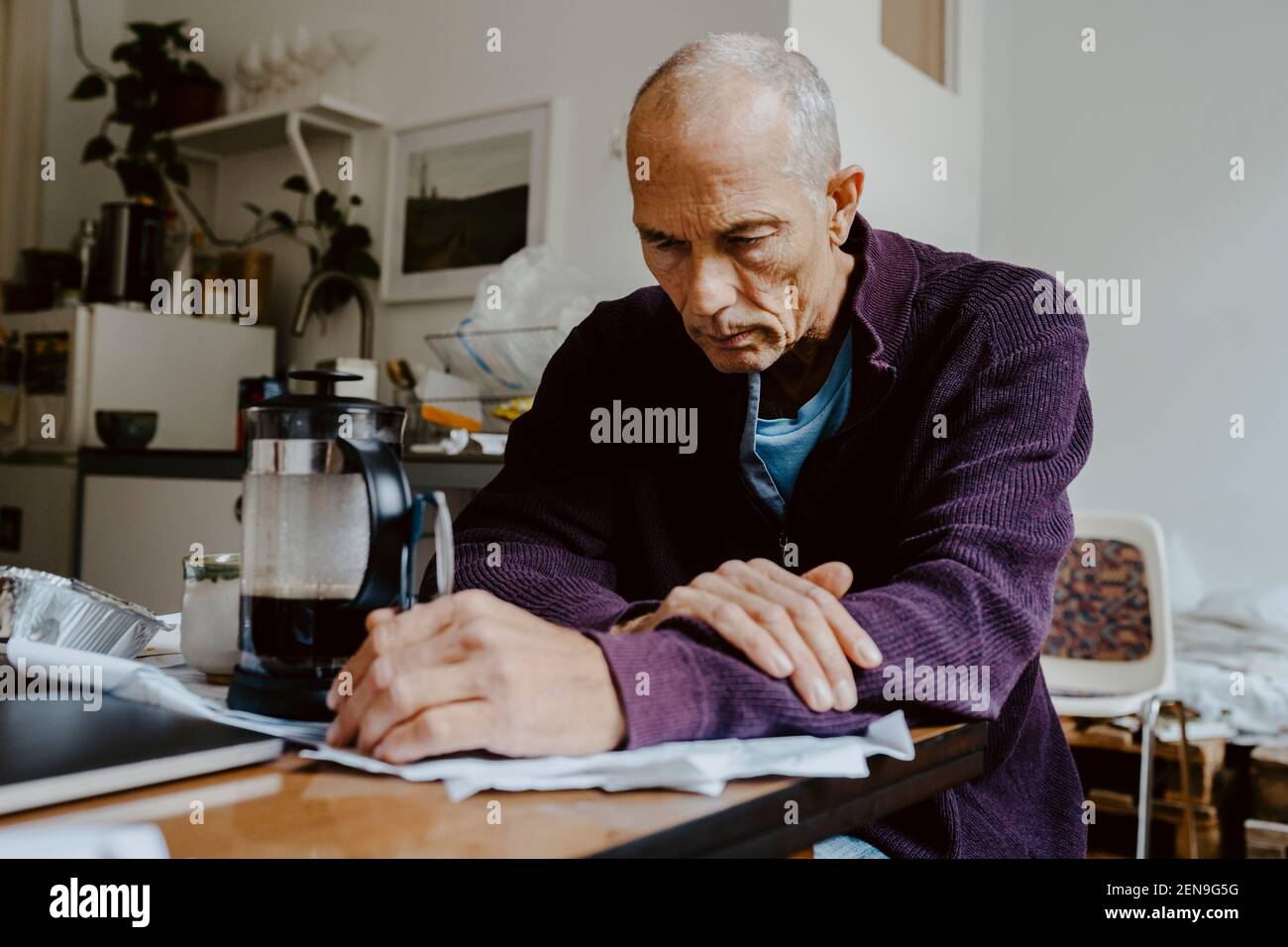 Sad looking men sitting table hi-res stock photography and images - Alamy