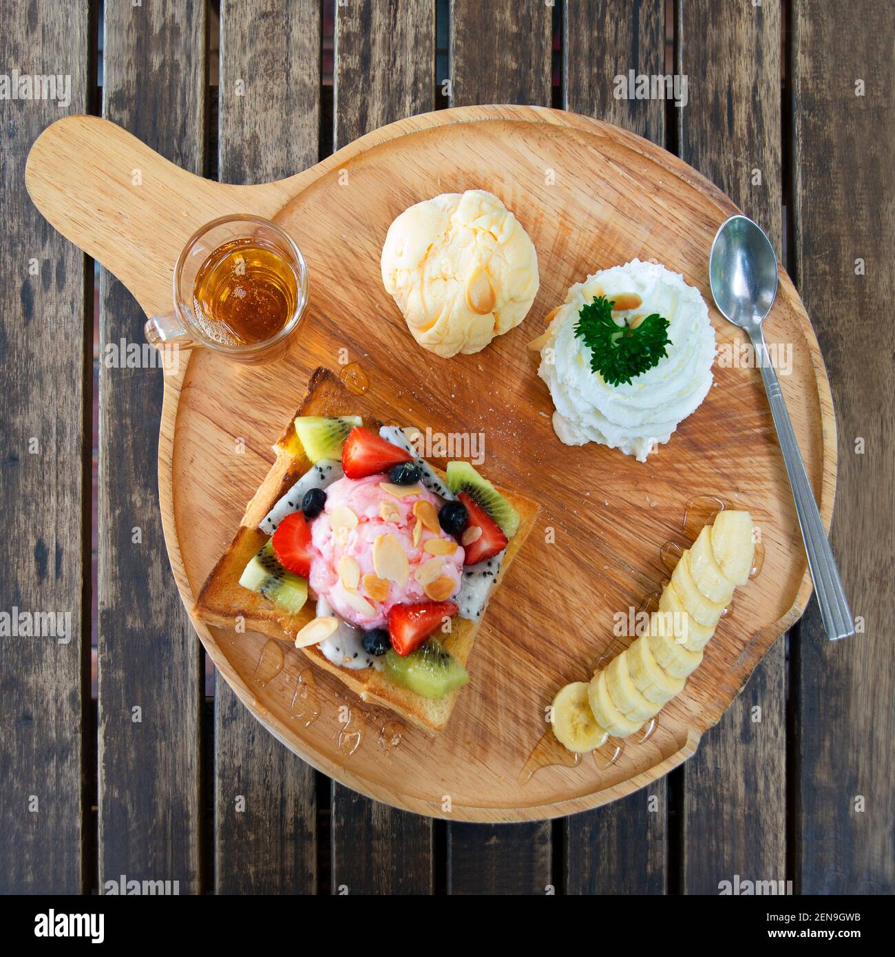 Top view of sweet dessert in western style served in circular wooden ...