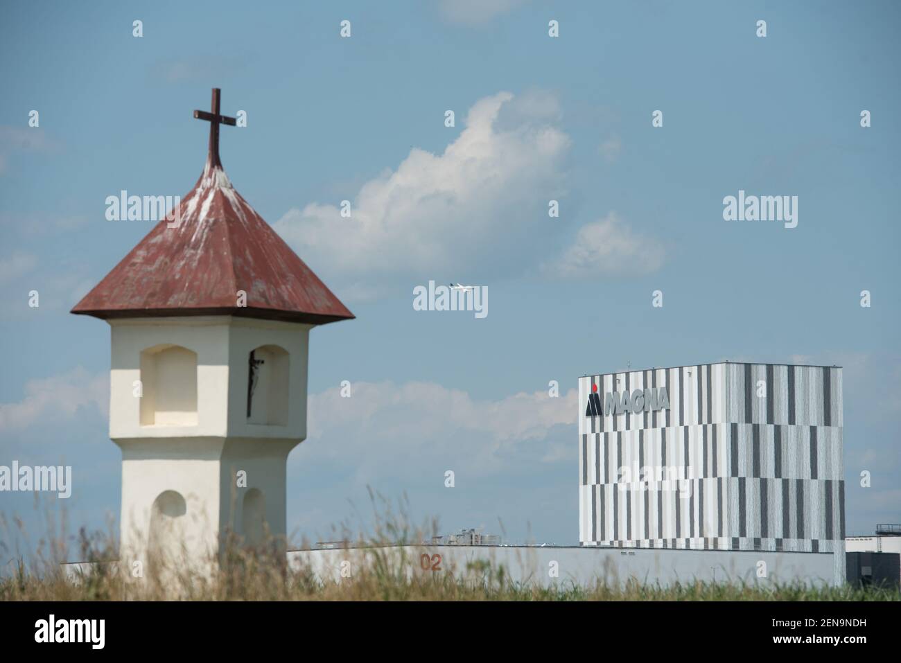 Magna Steyr new paint shop plant is pictured in Hoce near a church ...