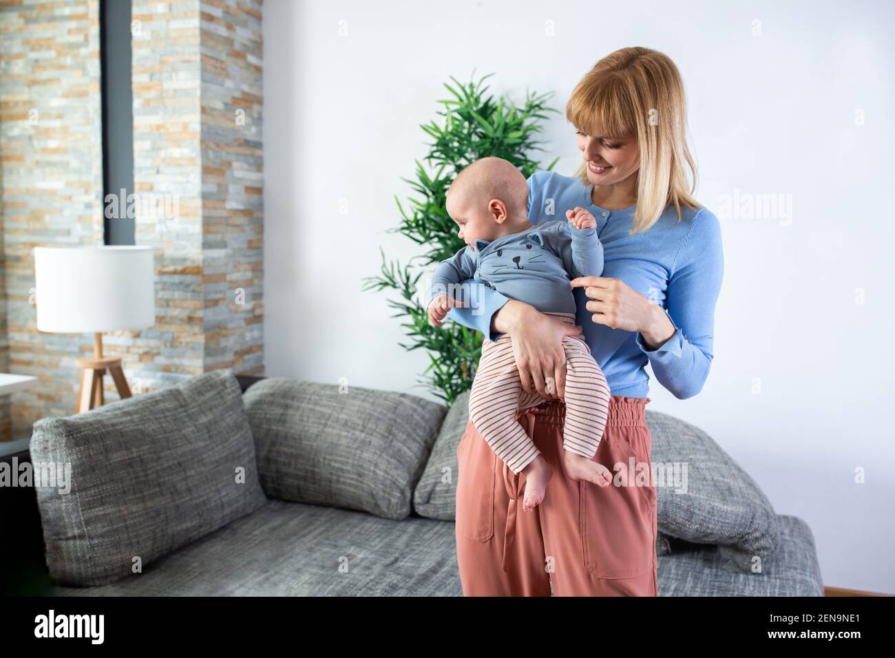 Caring mother tending to her child, eternal and unconditional love ...