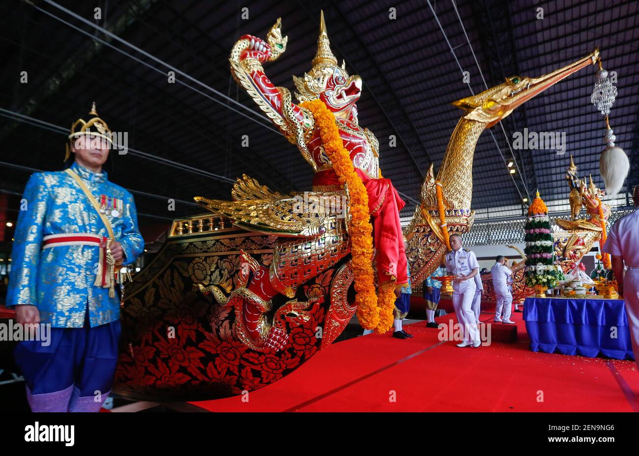 Thai oarsmen stand behind a royal barge before a worship ceremony which ...