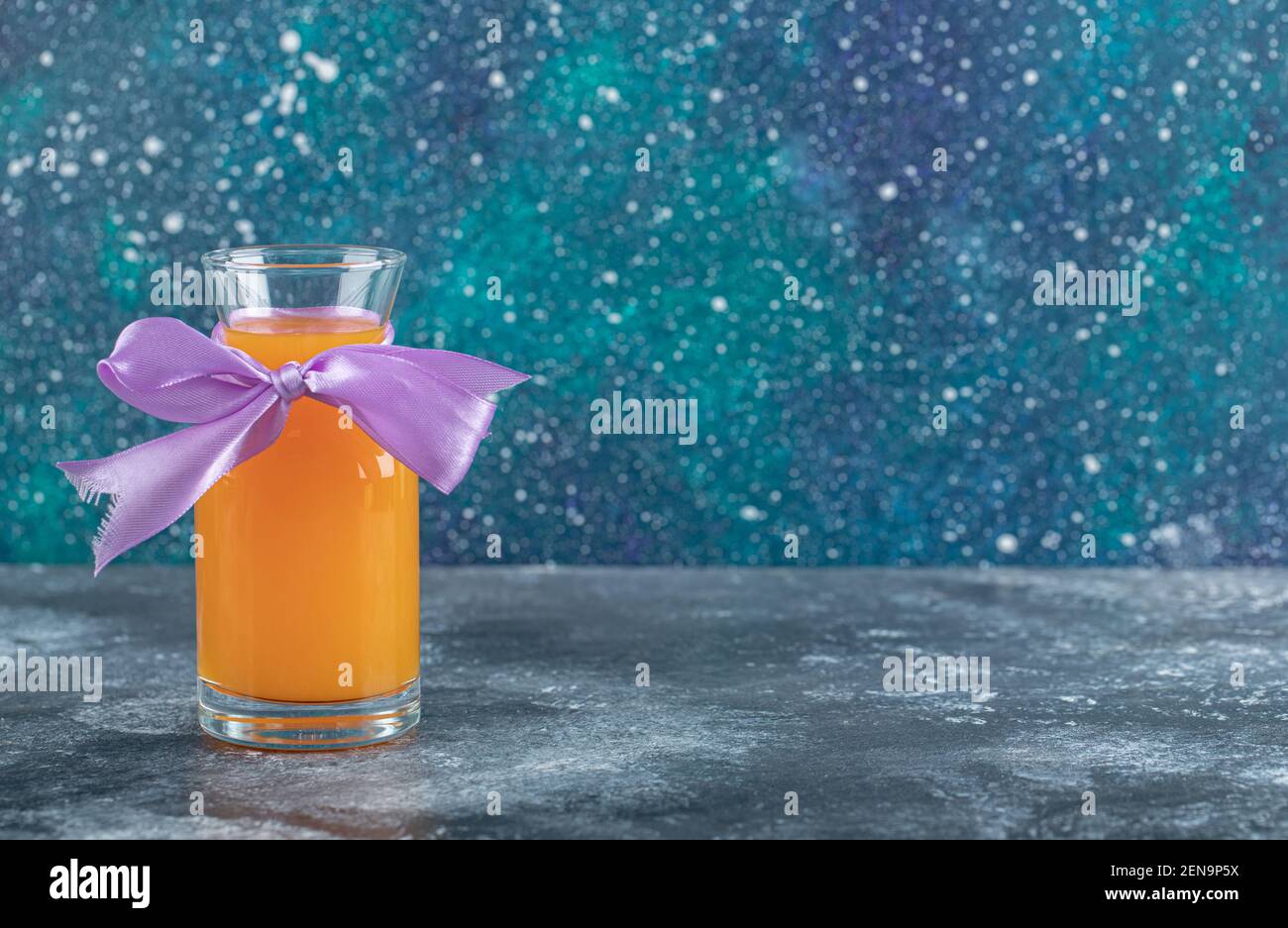 Glass of orange juice on marble background Stock Photo - Alamy
