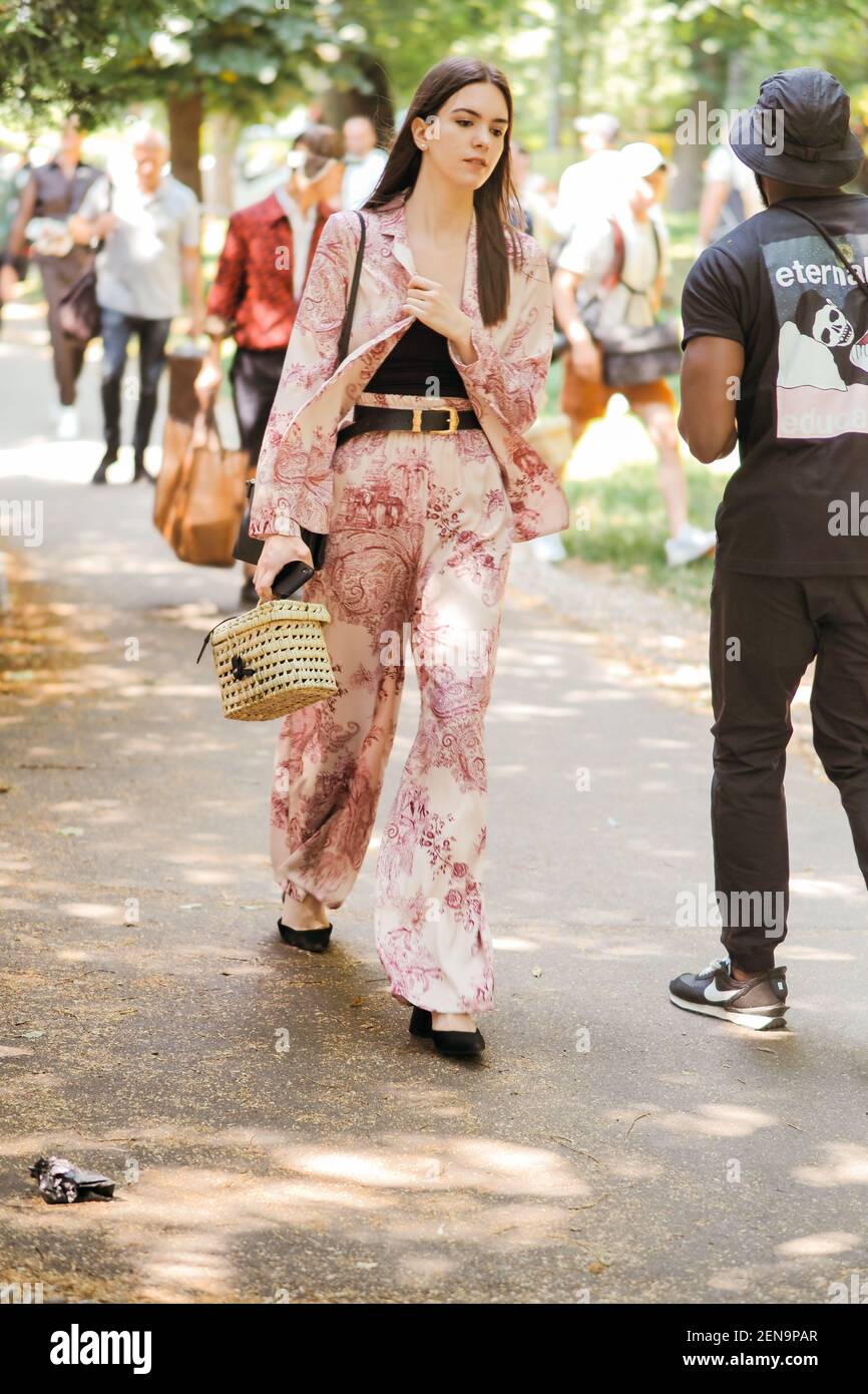Trendy women and men pose for street snap during the Milan Fashion Week ...