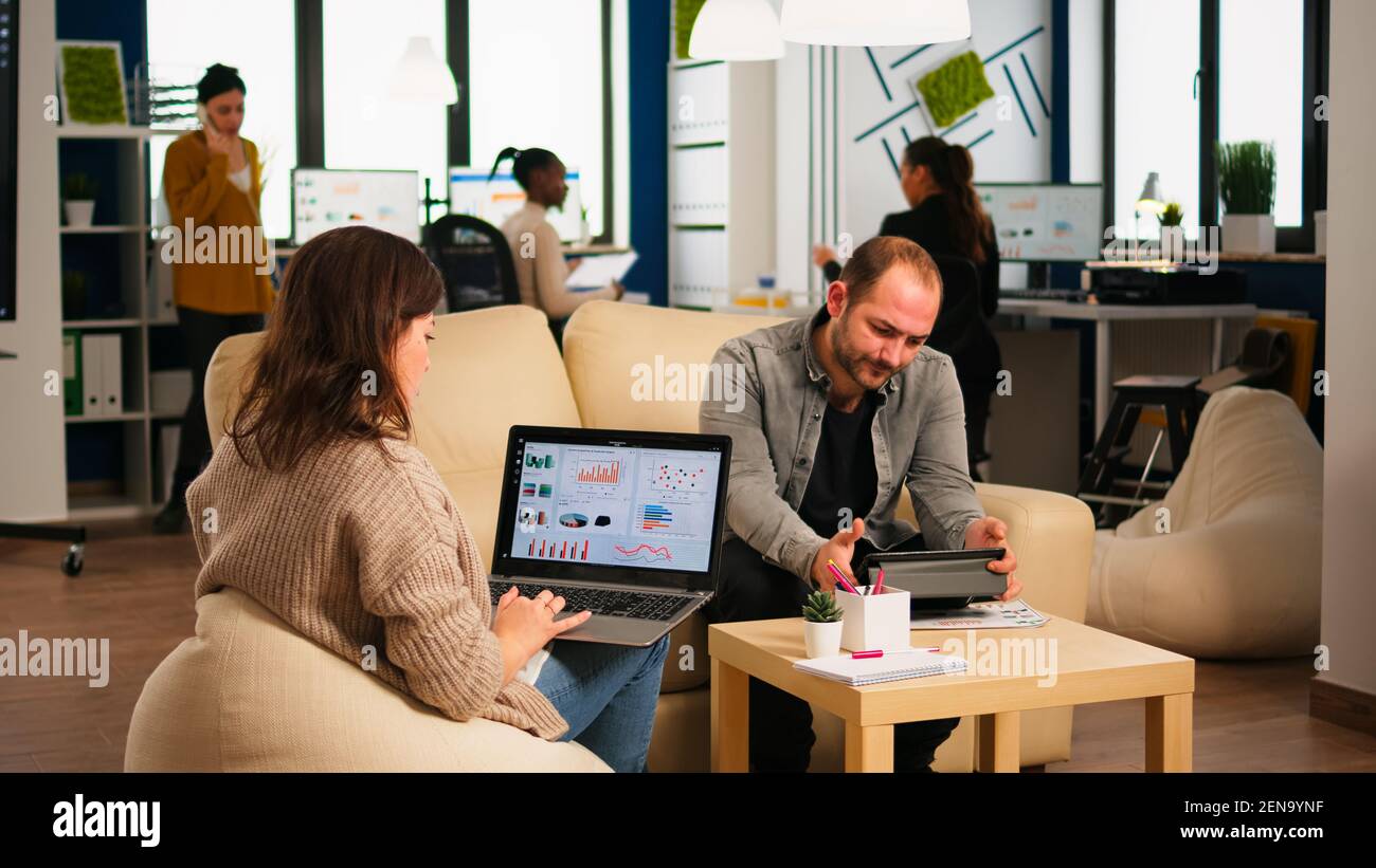 Back view video of young business woman sitting on couch in office ...