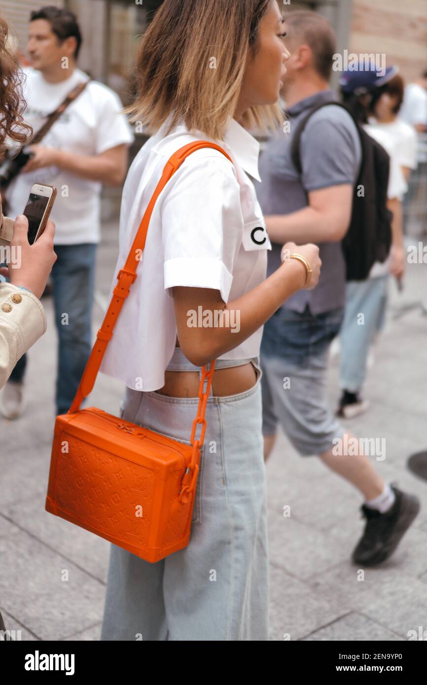 Trendy women and men pose for street snap during the Paris Fashion Week ...