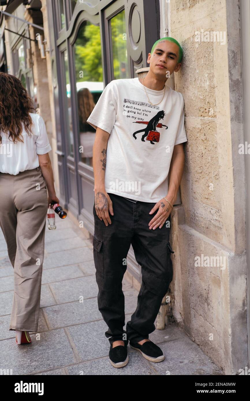 Trendy women and men pose for street snap during the Paris Fashion Week ...
