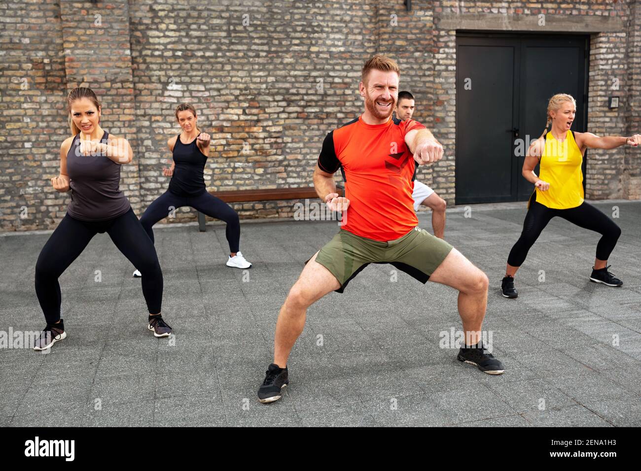 Martial art coach training his group of people, fist punch Stock Photo ...