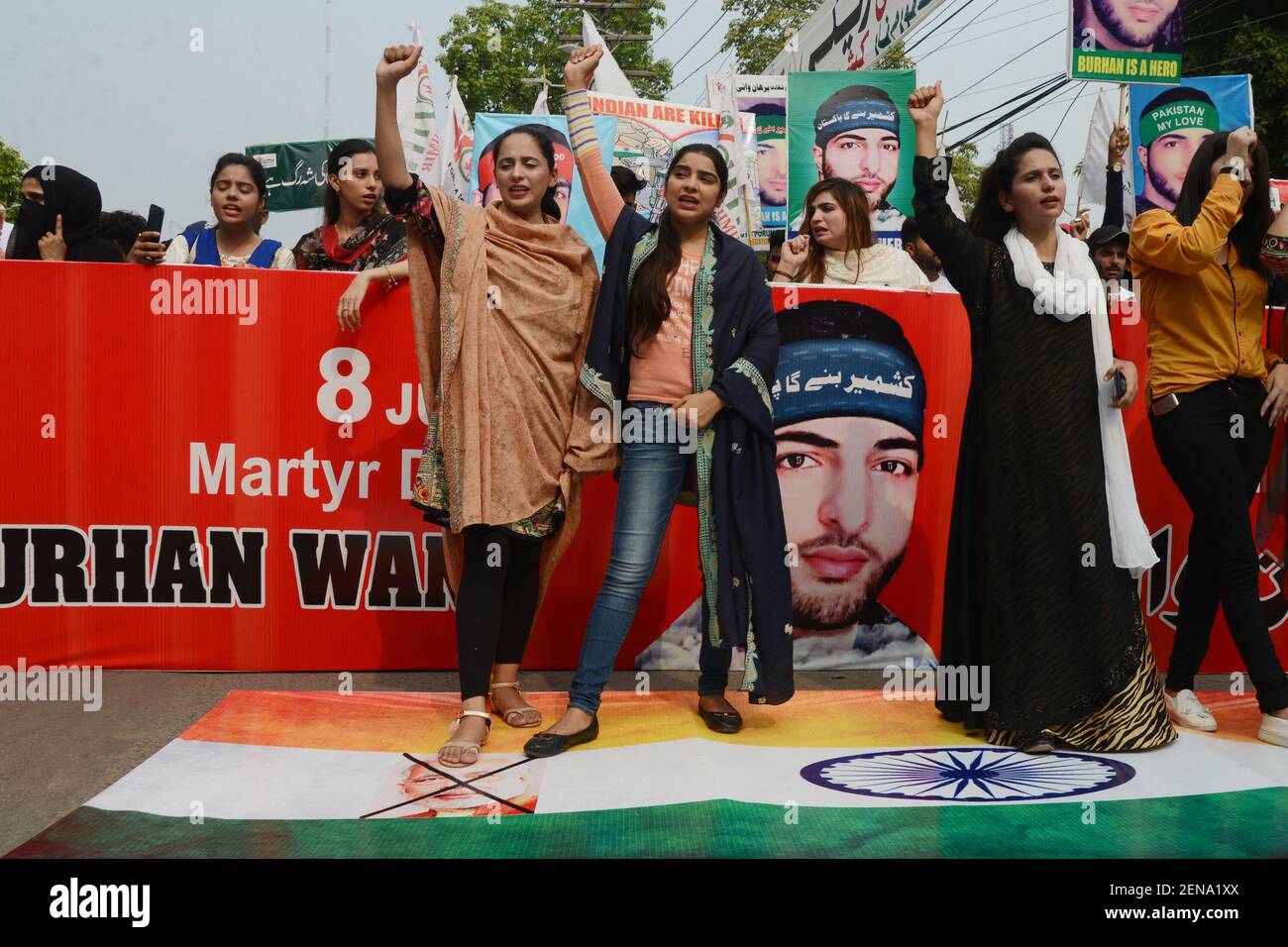 Pakistani activists of Youth Forum for Kashmir hold placards featuring ...