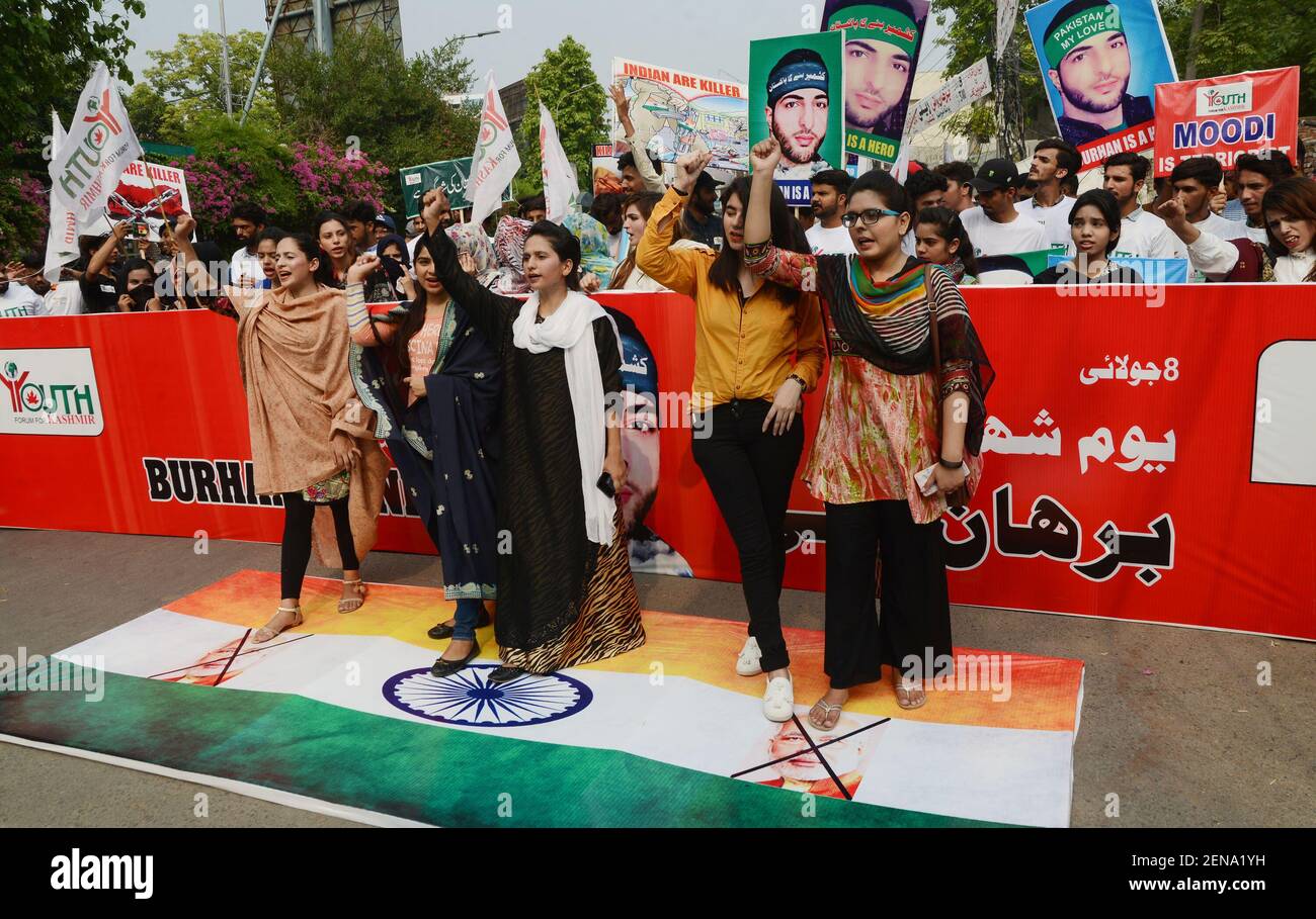 Pakistani activists of Youth Forum for Kashmir hold placards featuring ...
